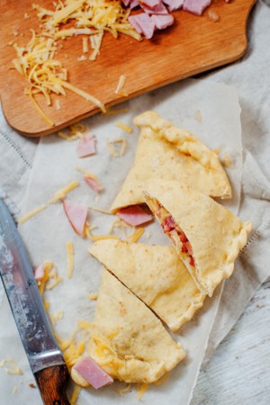 Ham and Cheddar Calzones Recipe | Tasteaholics